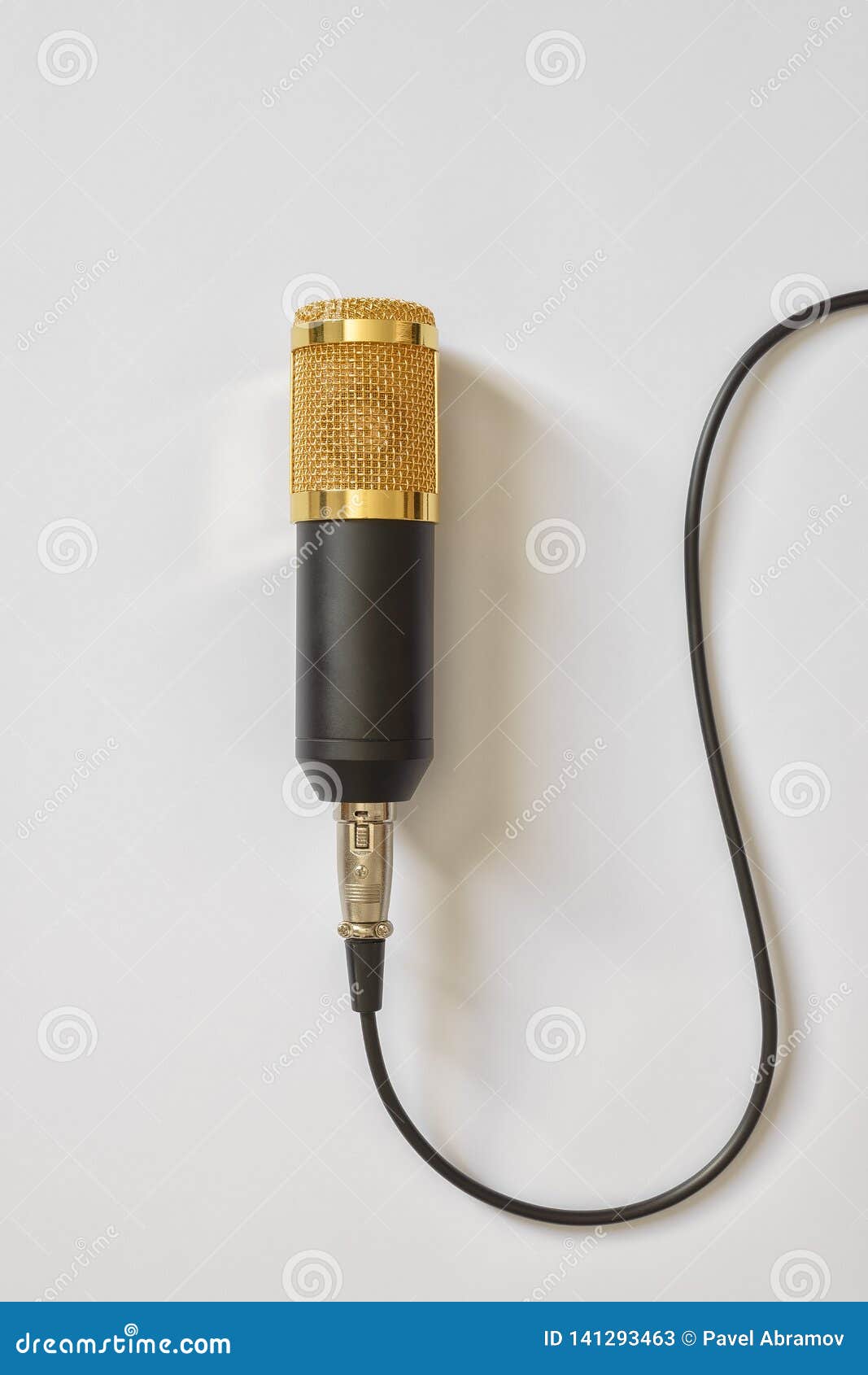 The Black Yellow Microphone with the Wire on a White Background ...