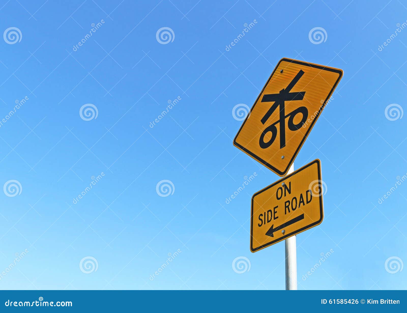 Black and Yellow Trains on Side Road Sign in Bright Blue Cloudless Sky ...
