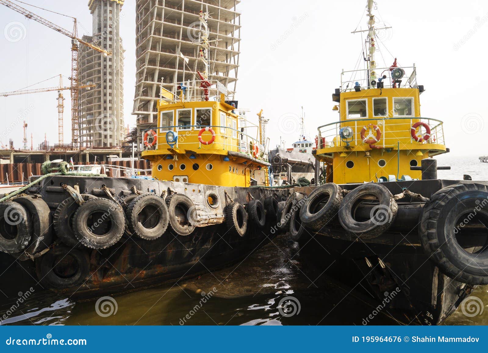 The Black and Yellow Tug Boat Stand is Moored Stock Photo - Image of ...