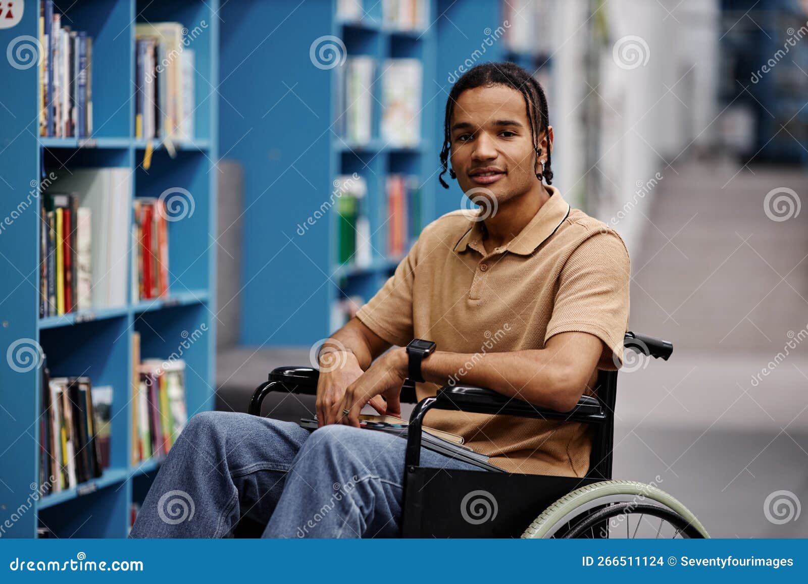 Black Young Man with Disability in Library at Modern College Stock ...