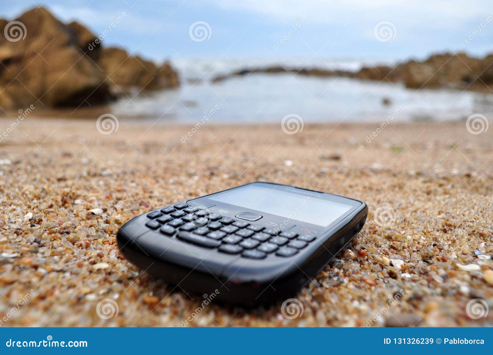 Blackberry Phone on Beach editorial stock image. Image of phone - 131326239