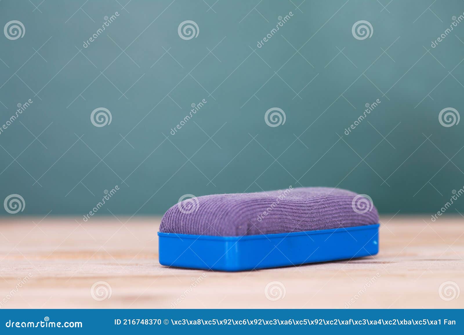 A Blackboard Eraser on the Desk in Front of the Blackboard Stock Photo ...