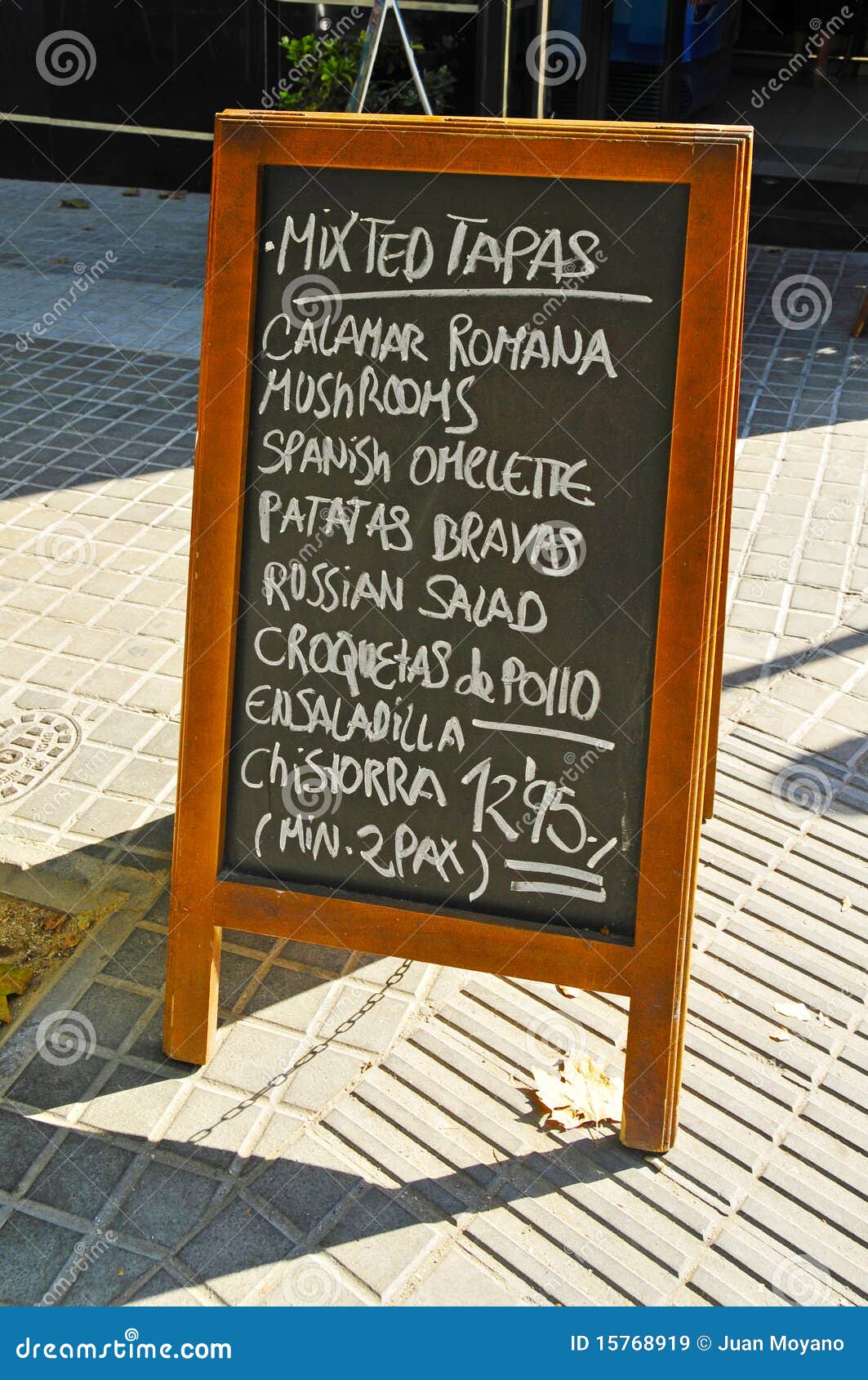 Blackboard Menu With Easel On Wooden Table With Blur Restaurant Stock ...
