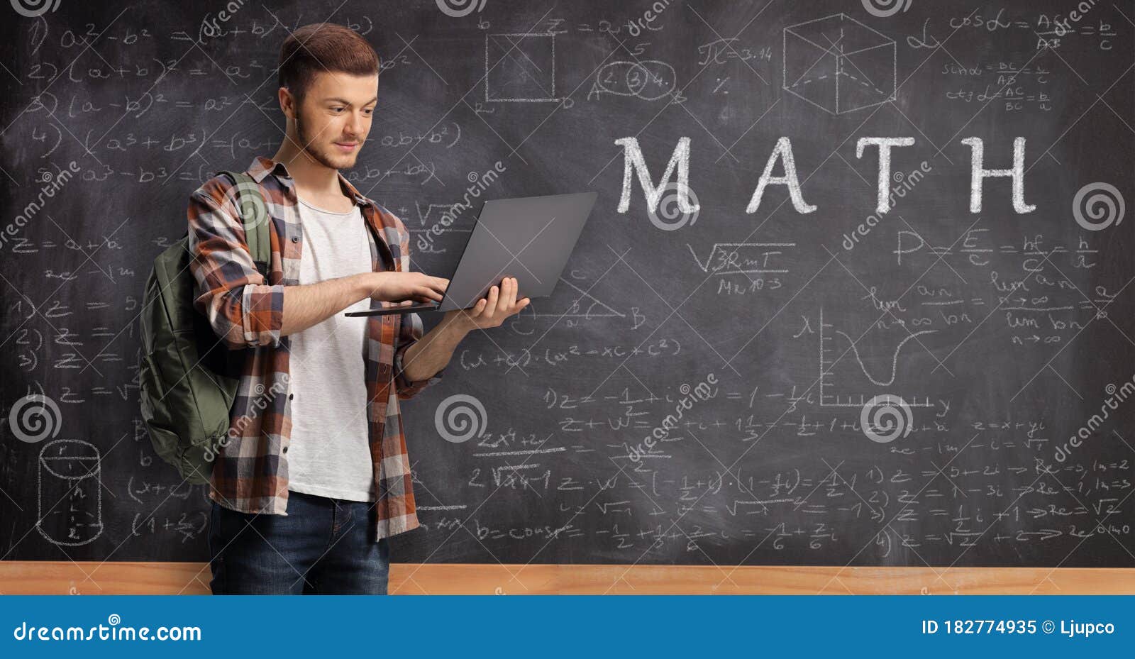 Blackboard with Text Math and Formulas and a Male Student with Laptop ...