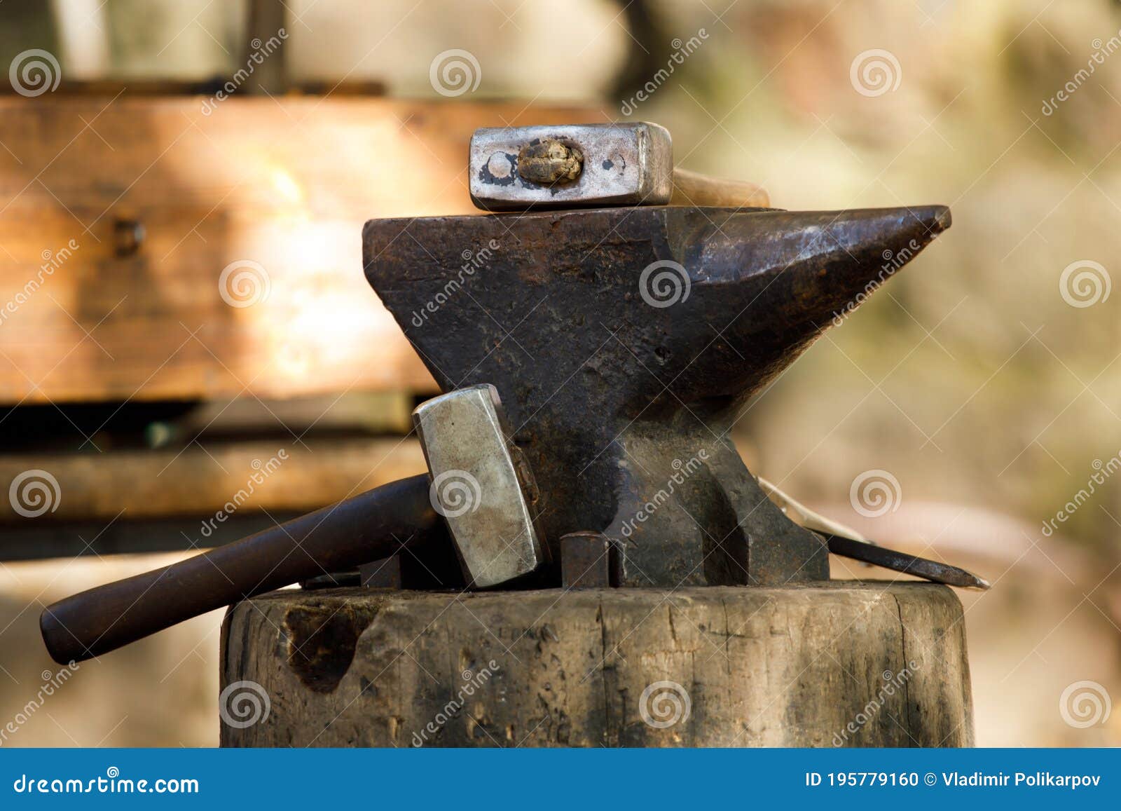Blacksmith Anvil with a Hammer Lie in Nature Stock Photo - Image of ...