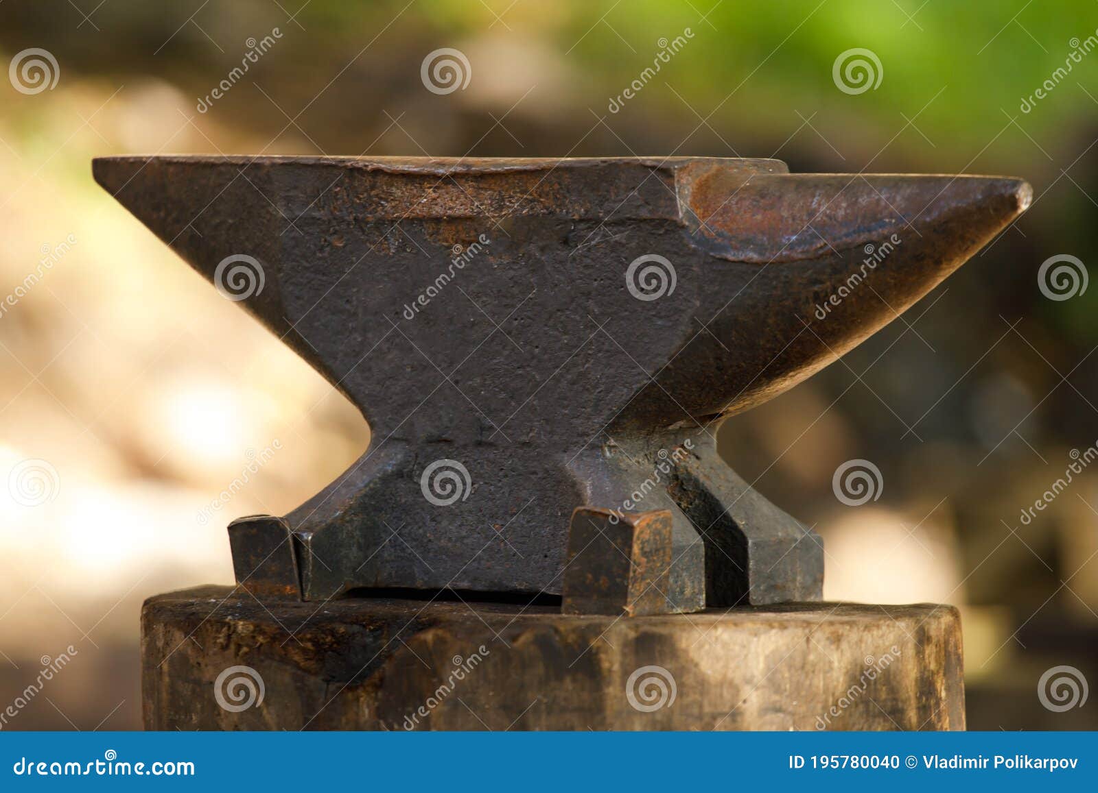 A Blacksmith Anvil Stands on a Tree Stump in Nature Stock Photo - Image ...