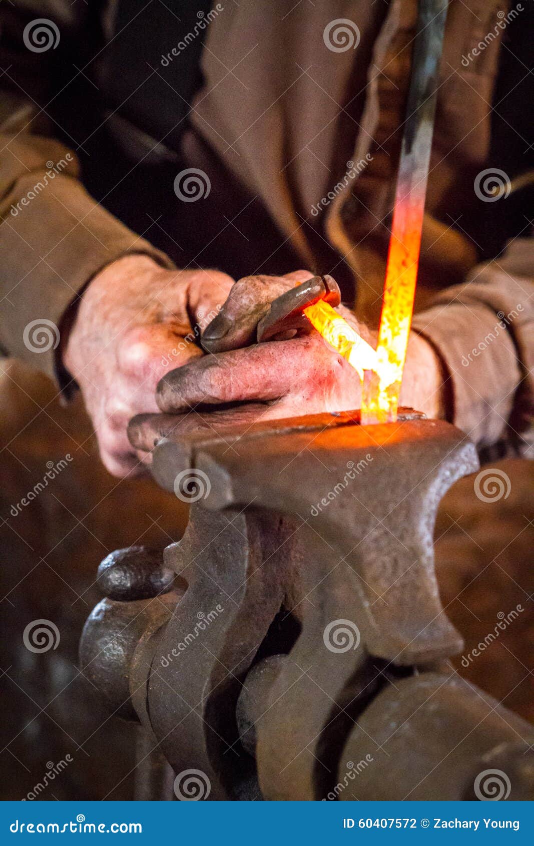 Blacksmith Bending a Hot Metal Rod Stock Photo - Image of sparks ...