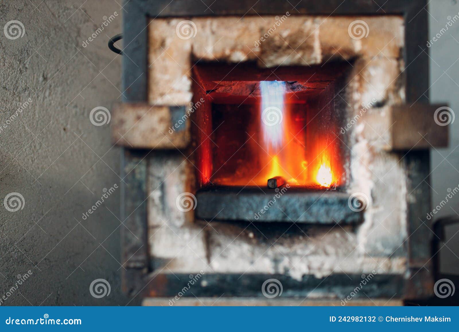 Blacksmith Forge Oven with Hot Flame. Smith Heating Iron Piece of Steel ...