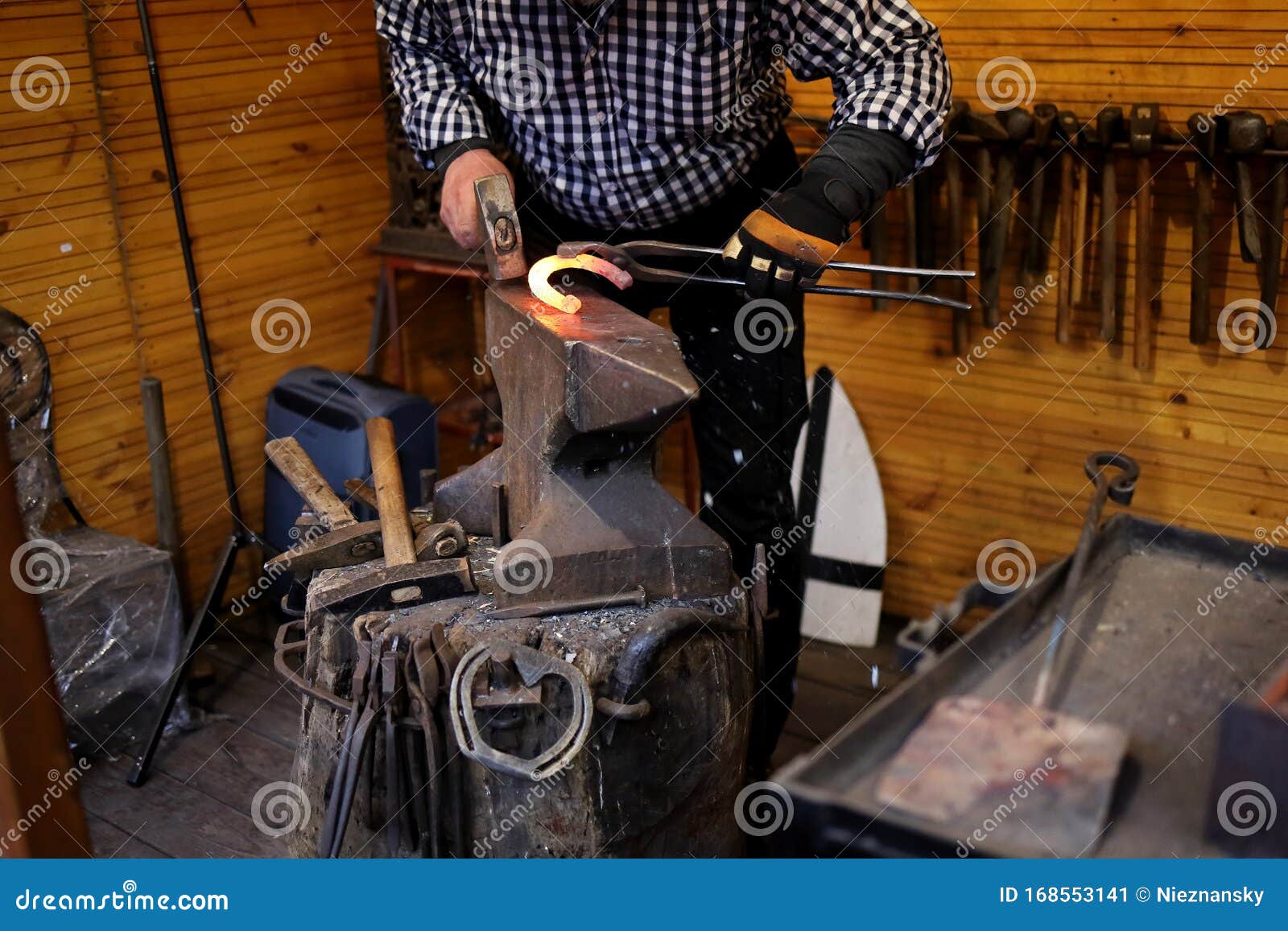 Blacksmith during work stock image. Image of steel, iron - 168553141