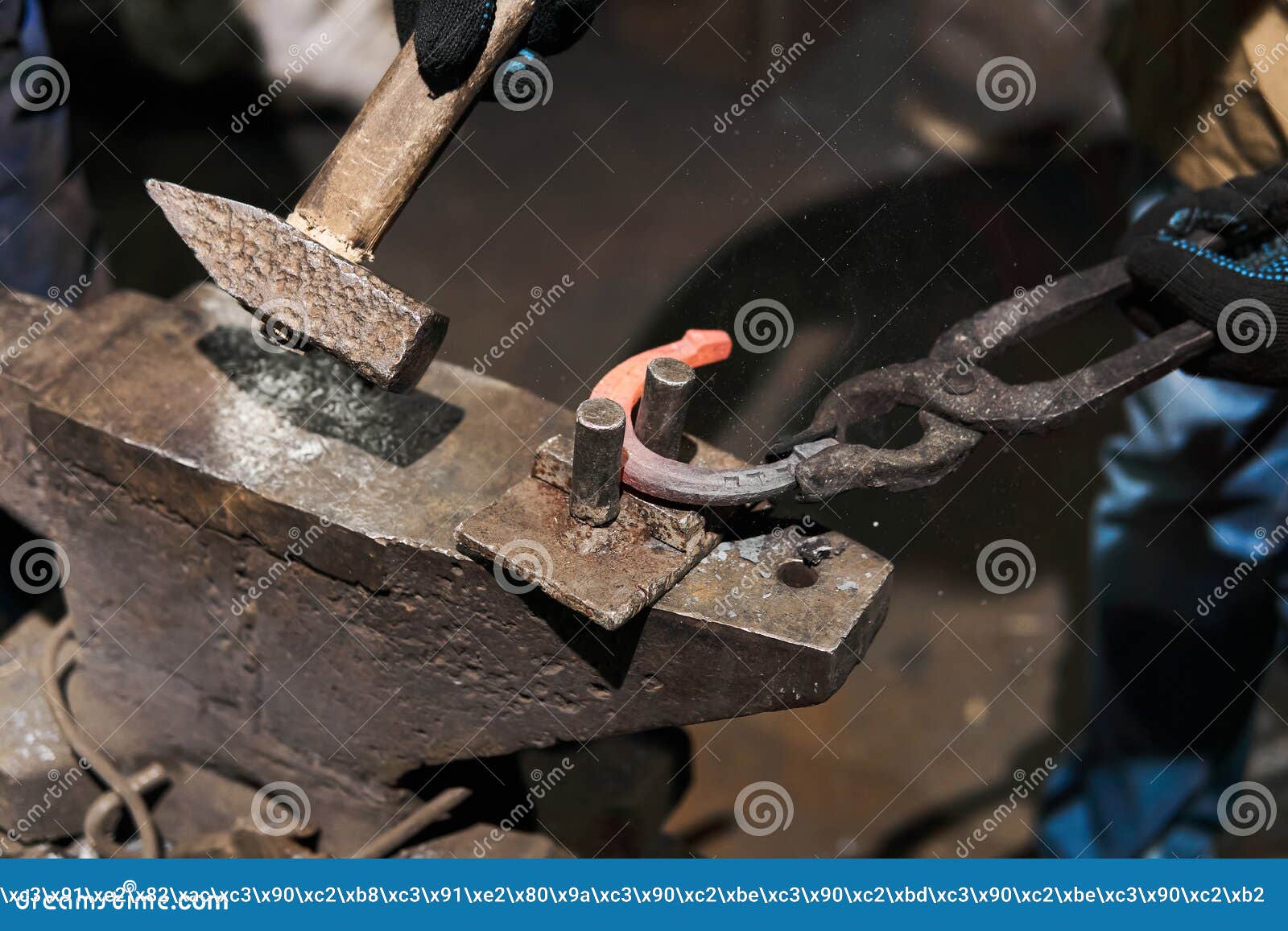 Blacksmith Forges Horseshoe With Hammer On Anvil. Ancient Craft ...
