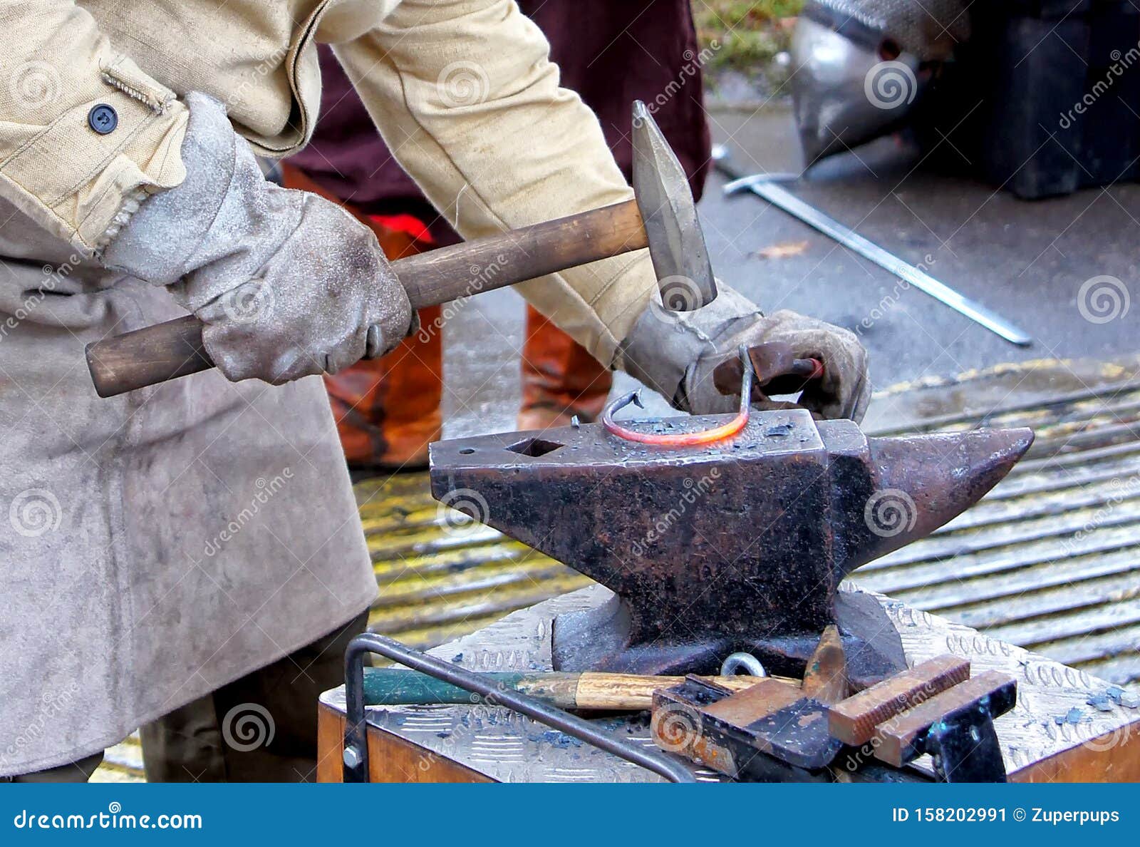 Blacksmith Forges Horseshoe With Hammer On Anvil. Ancient Craft ...