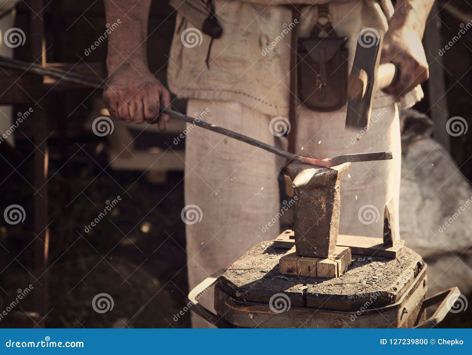 Blacksmith Forges Part on Anvil in Antique Clothes Stock Photo - Image ...