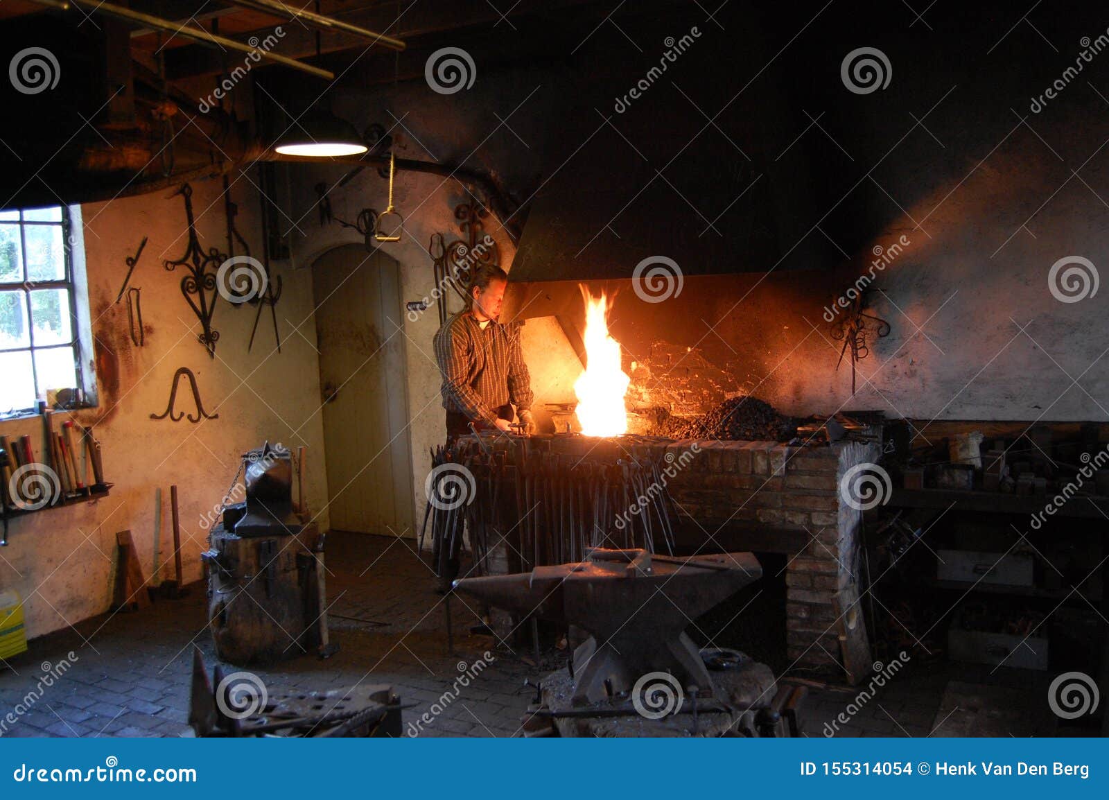 Blacksmith Forging a Nail in Front of a Blazing Fire Editorial Stock ...