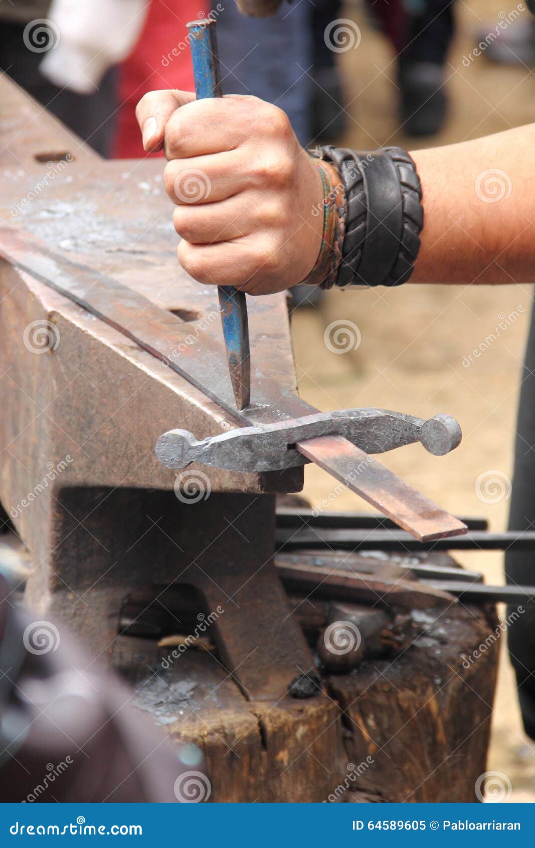 Blacksmith forging a sword stock image. Image of molten - 64589605
