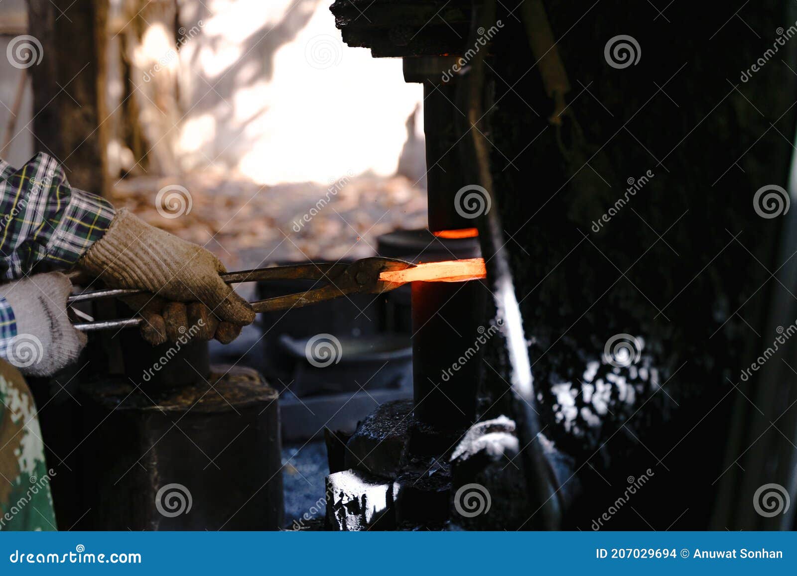 The Blacksmith is Forging Very Hot Iron To Make Various Tools Stock ...