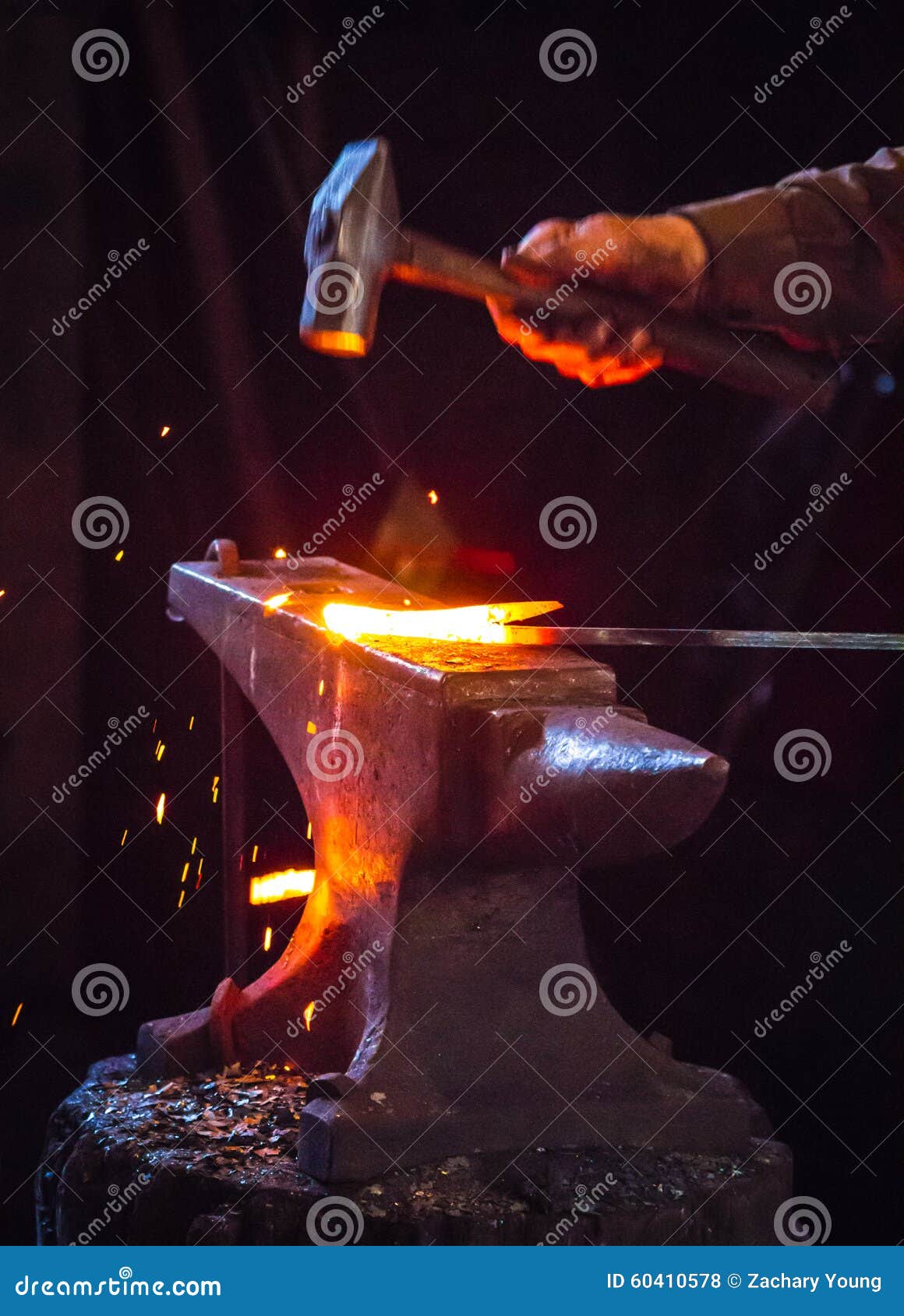 Blacksmith Hammering a Hot Metal Rod Stock Photo - Image of temperature ...