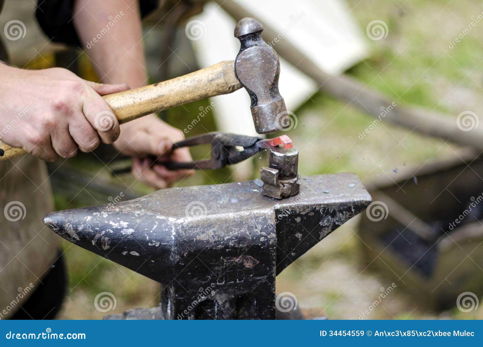 Blacksmith Hammering an Iron Stock Image - Image of heat, blacksmith ...