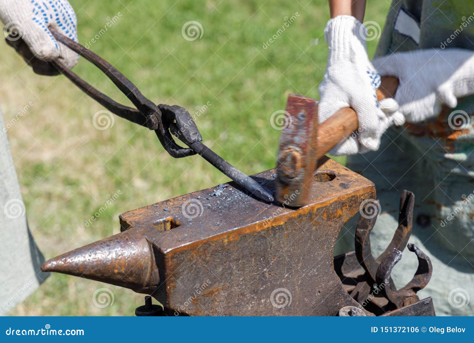 Blacksmith Hammering on a Metal Billet Lying on the Anvil Editorial ...