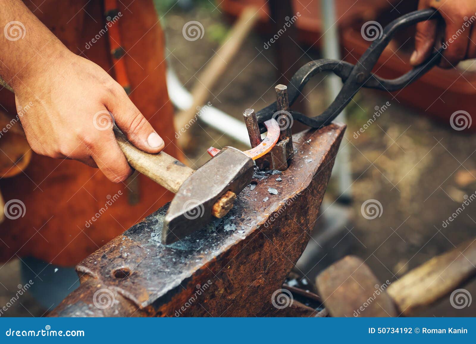 Blacksmith Hammering a Metal Rod Stock Photo - Image of ages, equipment ...