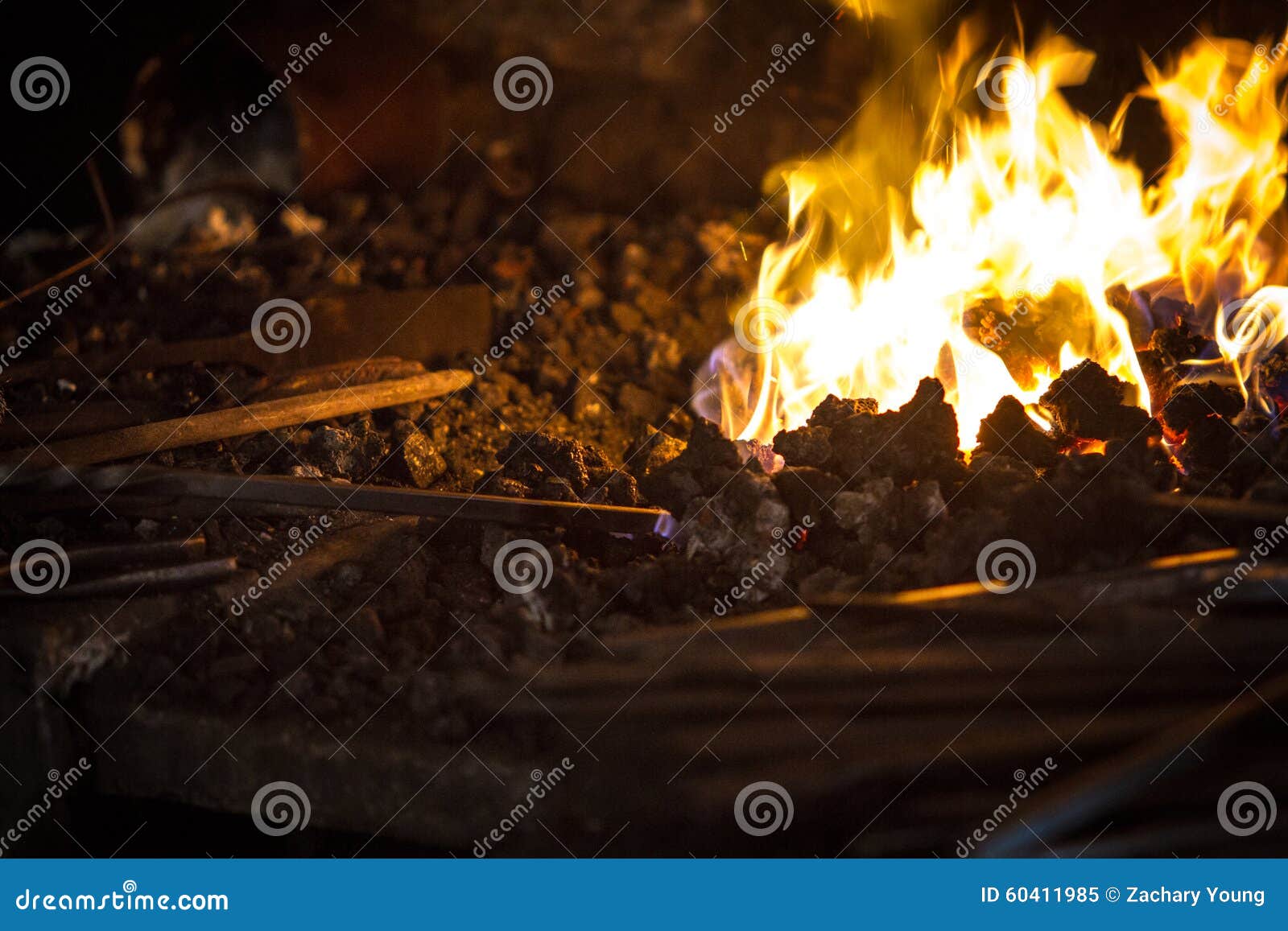 Blacksmith Heating a Metal Rod Stock Image - Image of industry, anvil ...