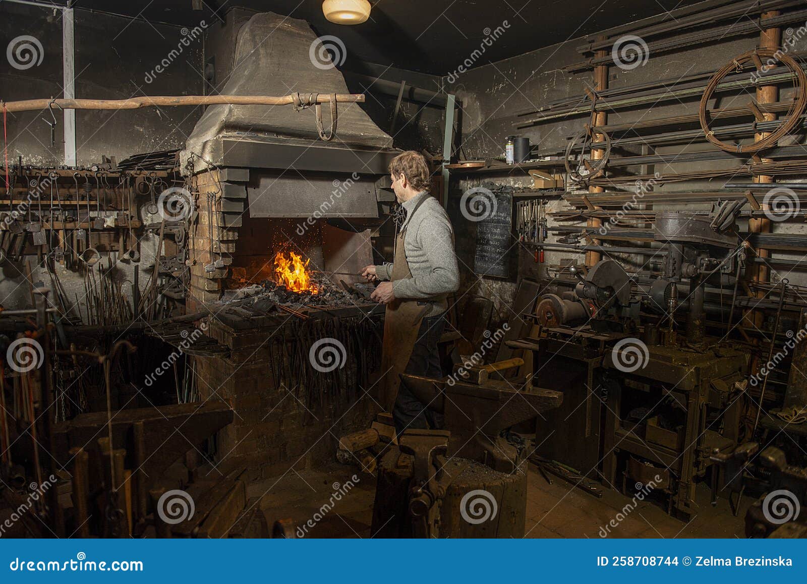 Blacksmith Heating Metal Rod in Fire Stock Photo - Image of manual ...