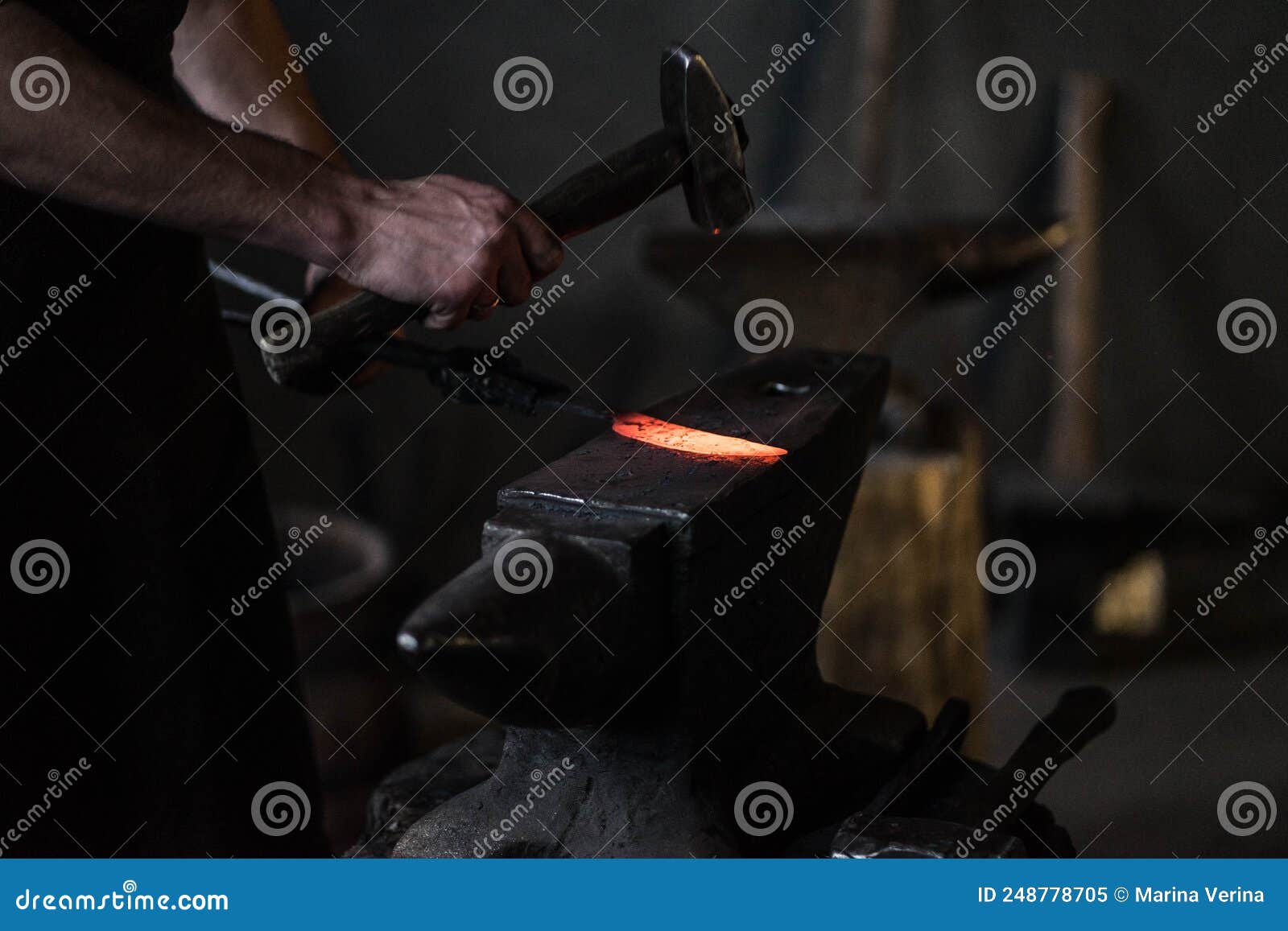 Blacksmith Hitting a Red-hot Iron with a Hammer Stock Image - Image of ...