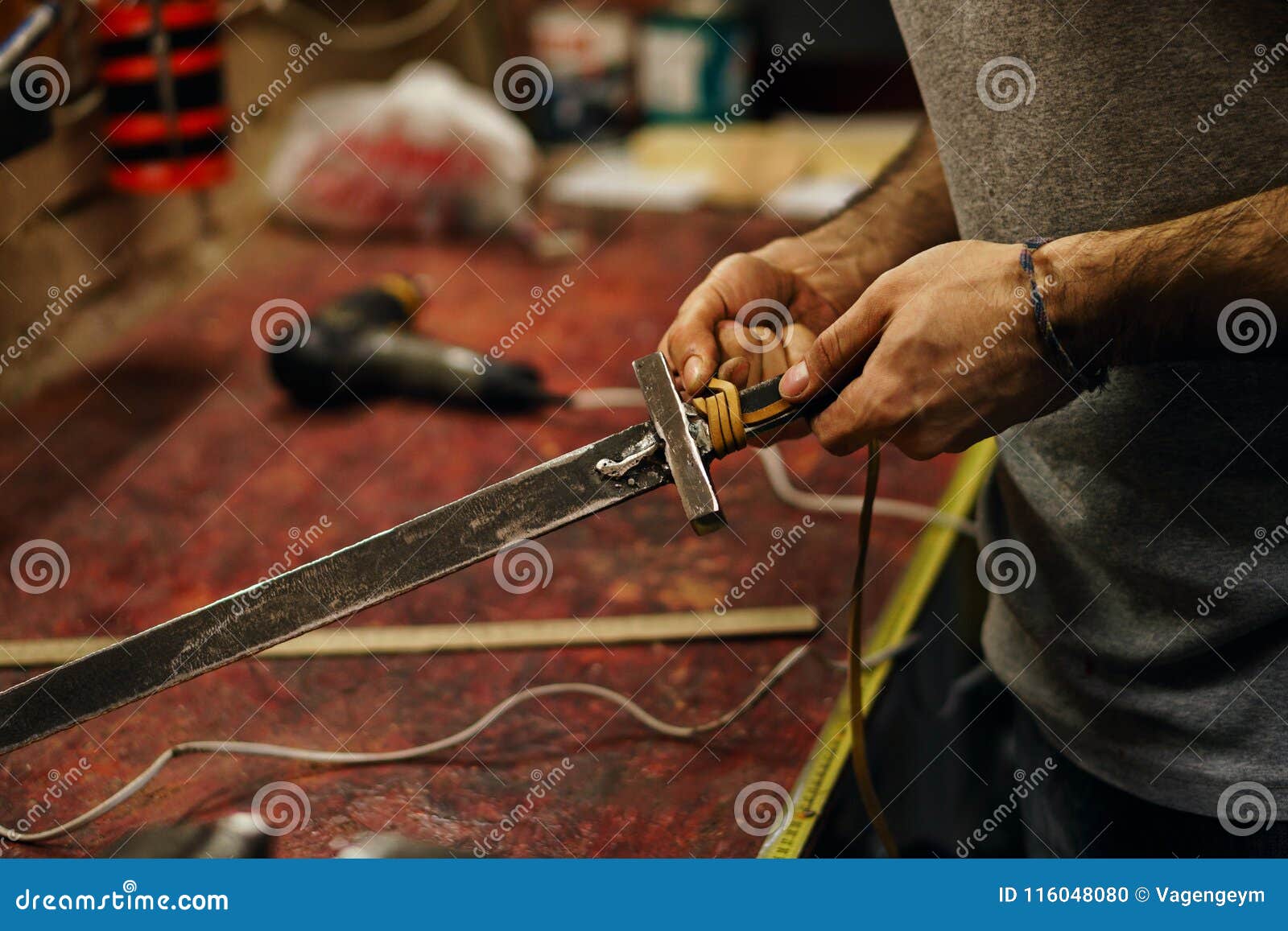 Blacksmith Makes Leather Winding Sword Stock Photo - Image of metalwork ...