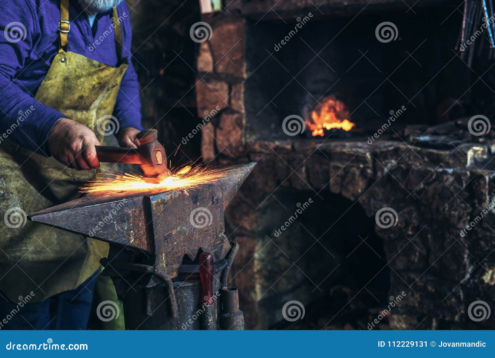 The Blacksmith Manually Forging the Molten Metal Stock Image - Image of ...