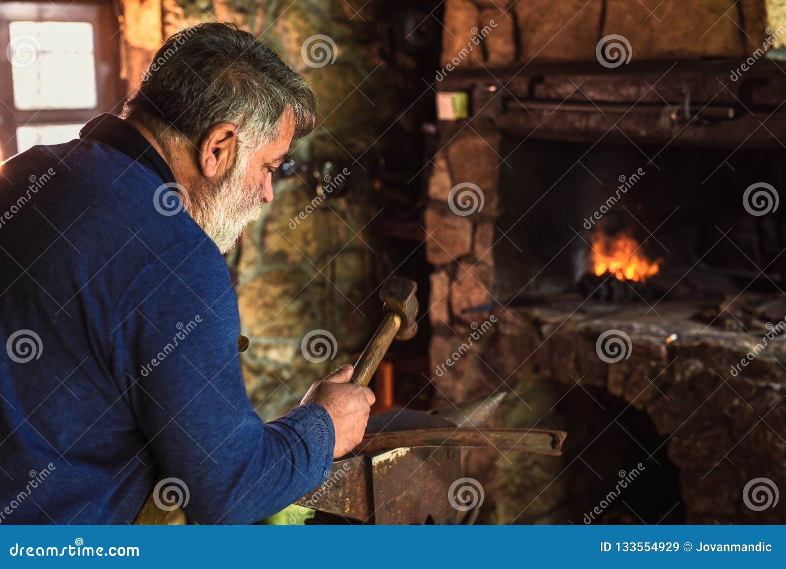 Blacksmith Manually Forging the Molten Metal Stock Image - Image of ...