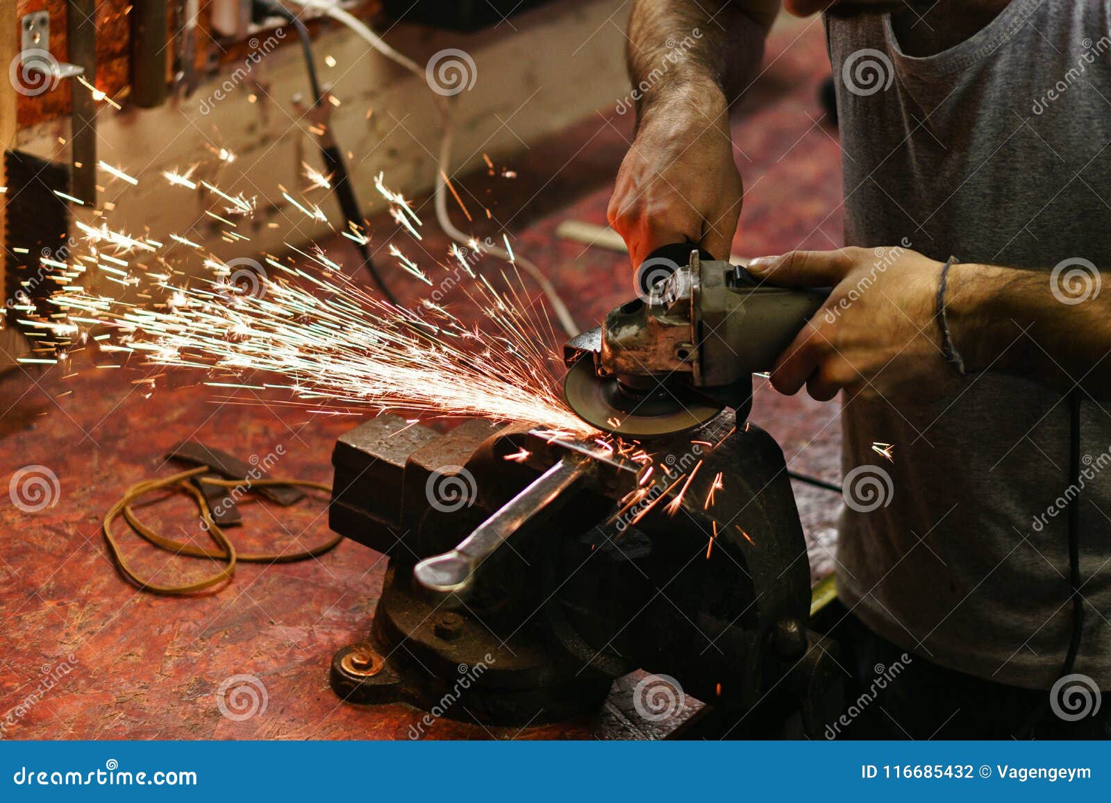 Blacksmith Polishes Crossguard Of Sword Picture. Image: 116685432