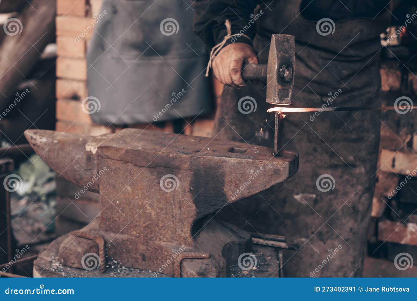 Blacksmith Process Glowing Metal with Hammer on Anvil in Forge. Dirty ...