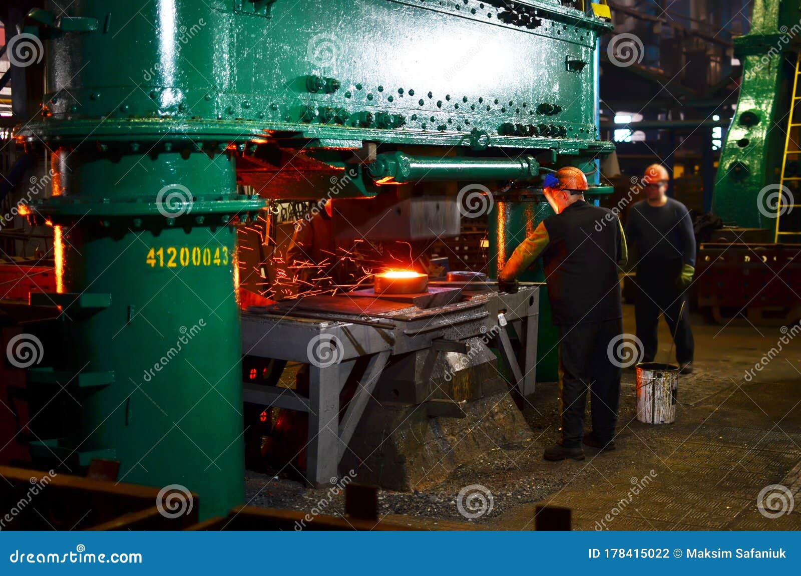 Blacksmith Processes the Red Hot Iron Under a Huge Press. Metal Forging ...