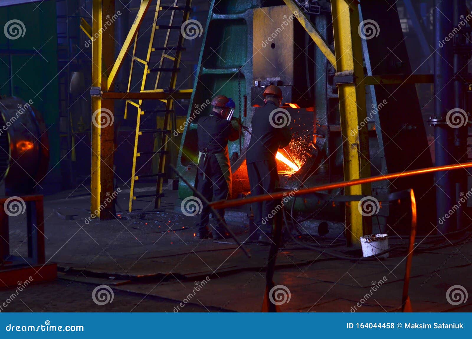 Blacksmith Processes the Red Hot Iron Under a Huge Press. Metal Forging ...