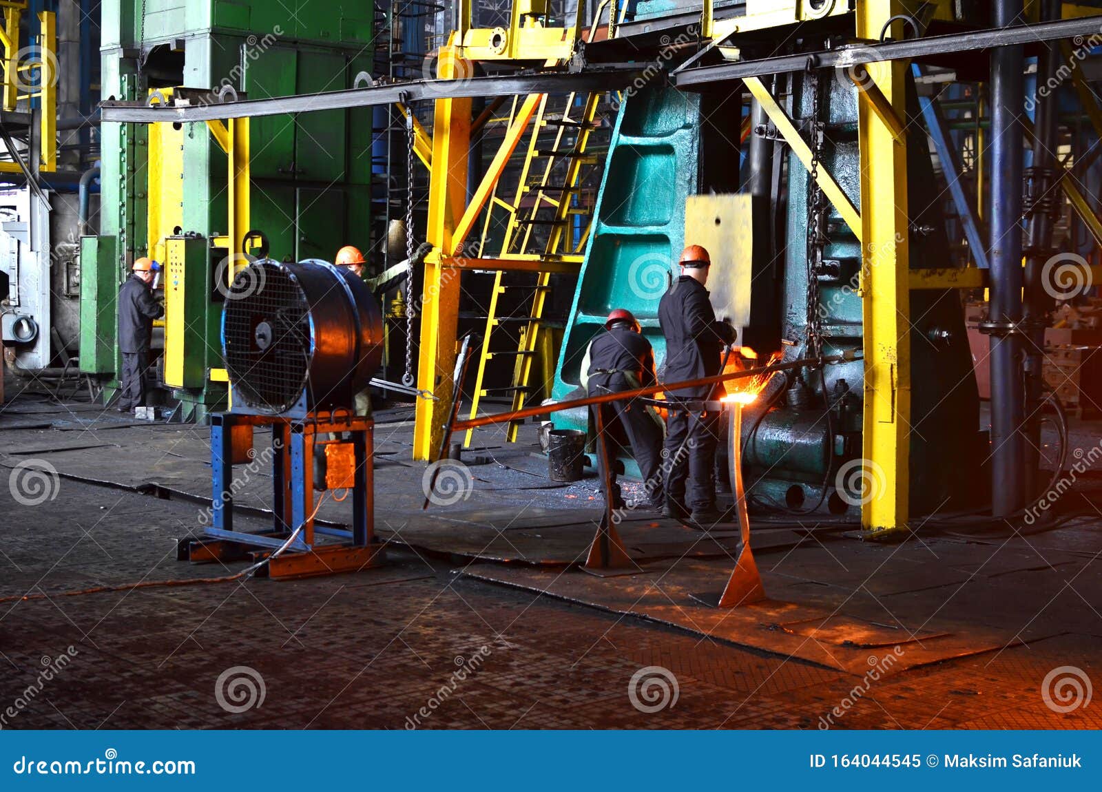 Blacksmith Processes the Red Hot Iron Under a Huge Press. Metal Forging ...