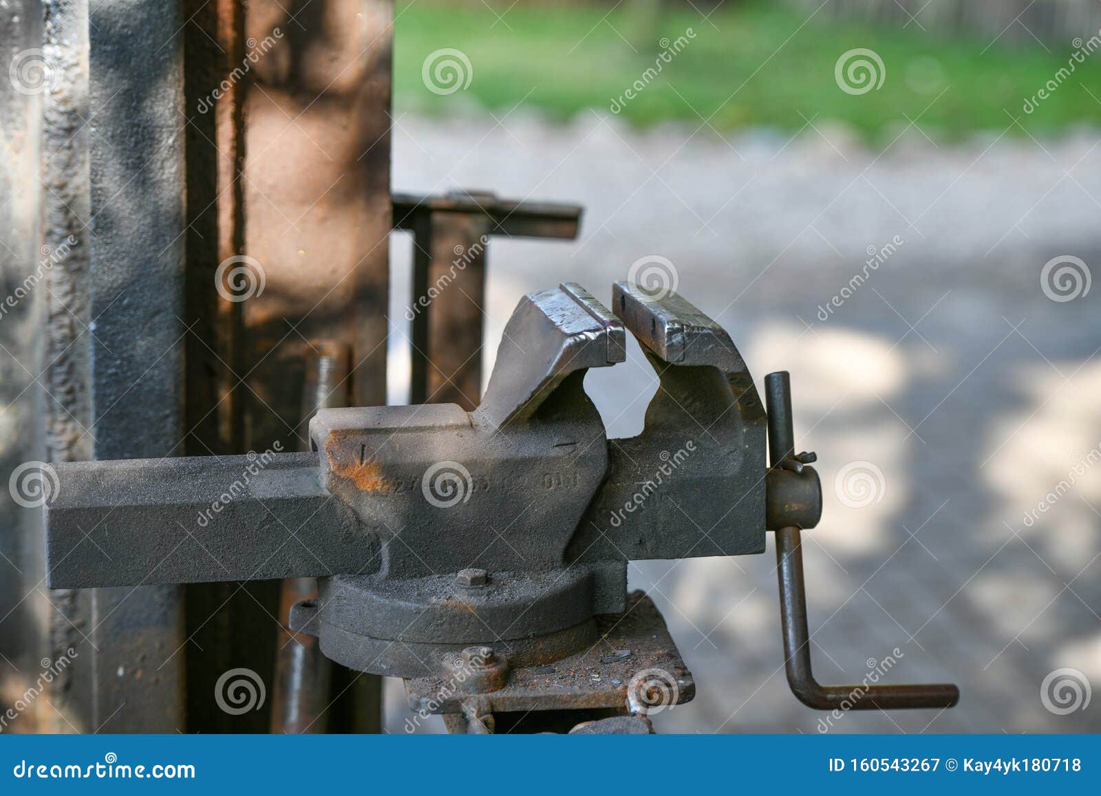 Blacksmith`s Clamp. Metal Clamping Device On An Old Workbench. Vise ...