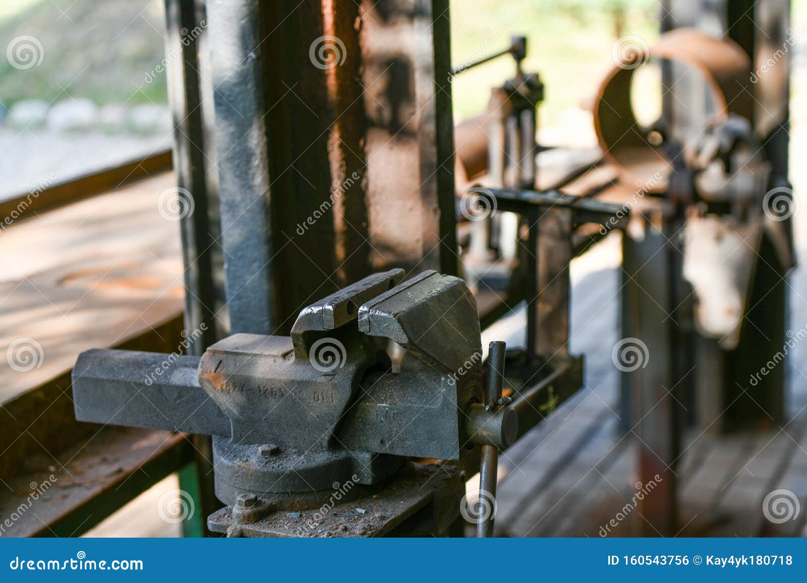 Blacksmith`s Clamp. Metal Clamping Device On An Old Workbench. Vise ...