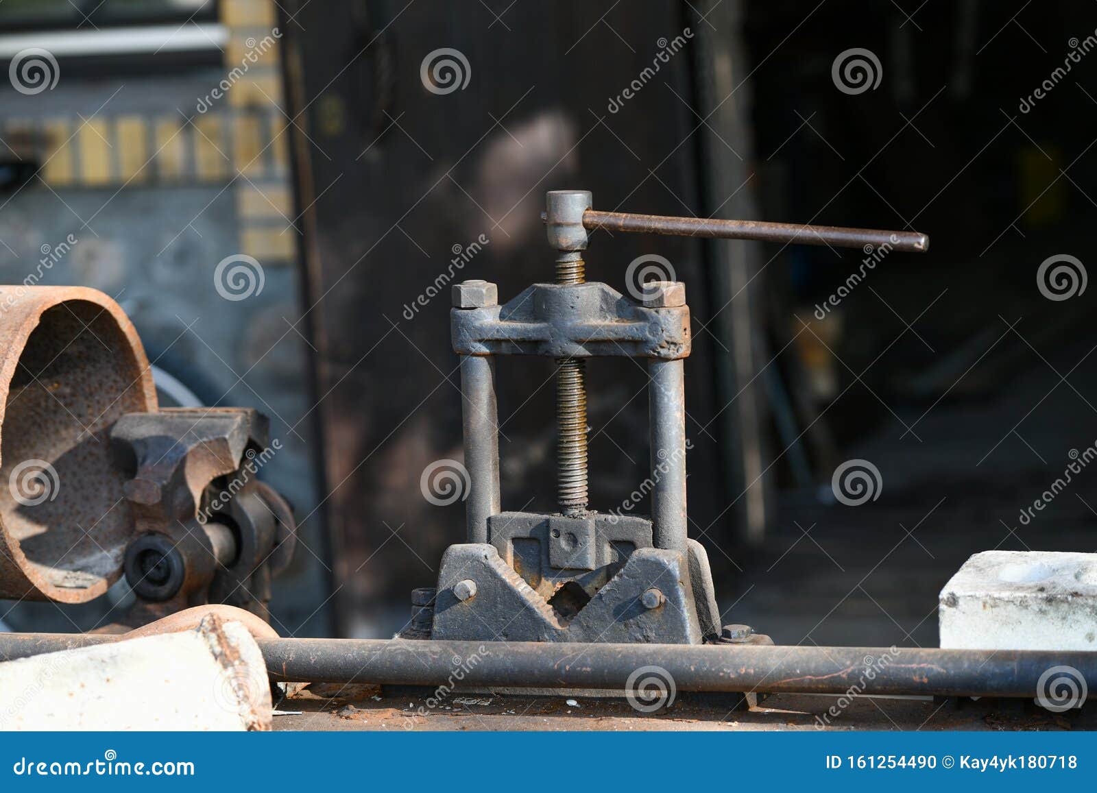 Blacksmith`s Clamp. Metal Clamping Device On An Old Workbench. Vise ...