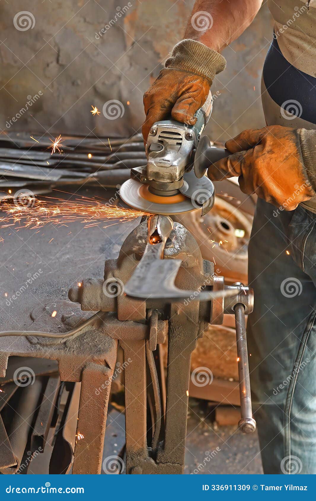 Worker Sharpens Cutting Tools in a Blacksmith S Workshop. Electric ...