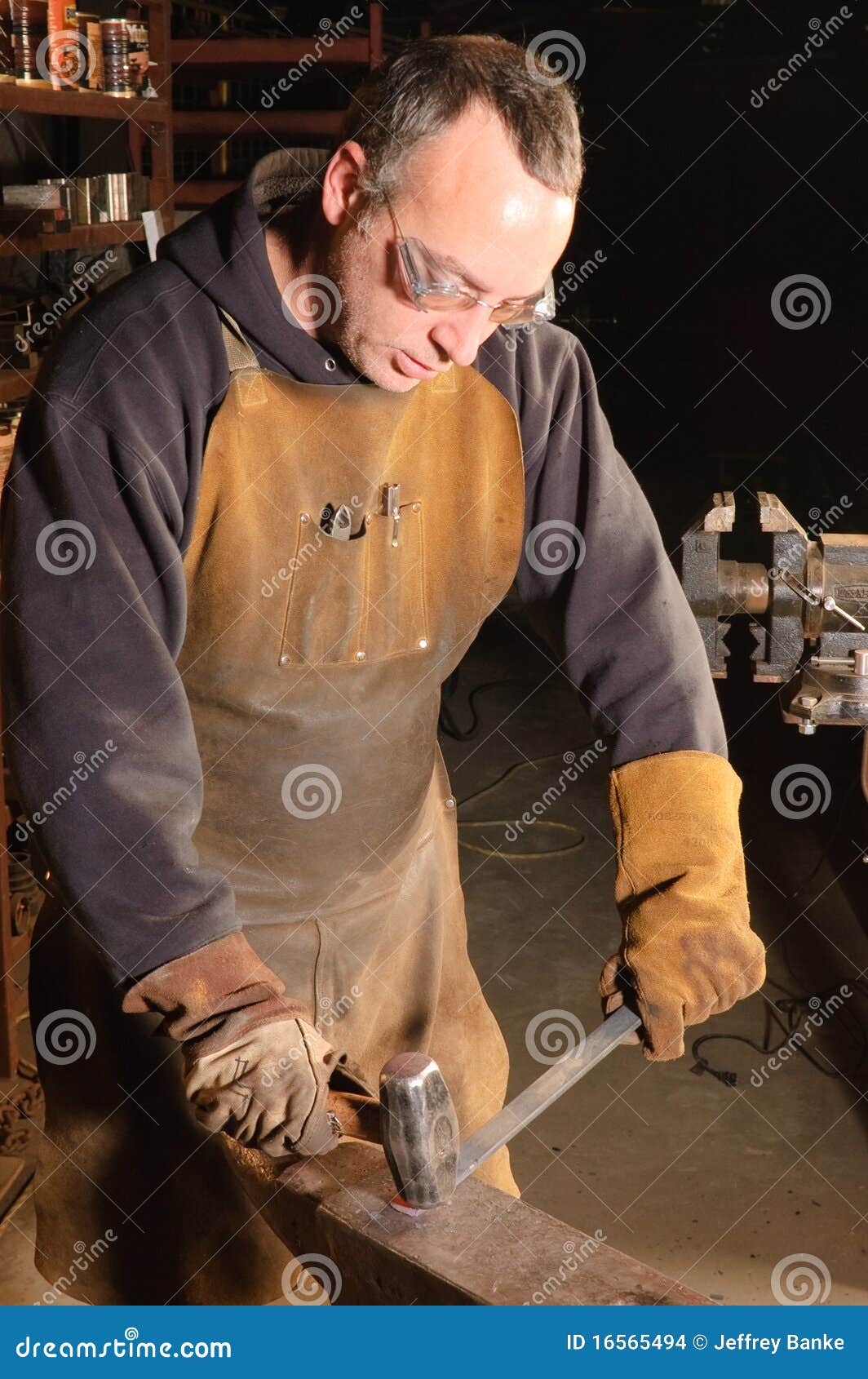 Blacksmith at work stock photo. Image of iron, pounding - 16565494