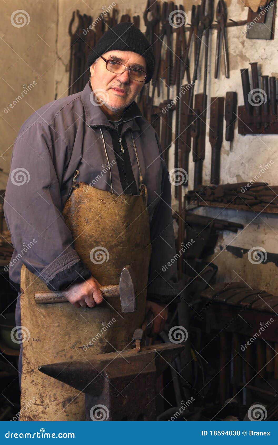 Blacksmith at work stock photo. Image of anvil, gear - 18594030