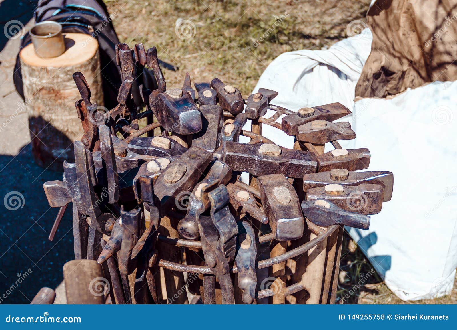 Blacksmith at Work. Hammers in a Metal Basket. There are a Lot of Them ...