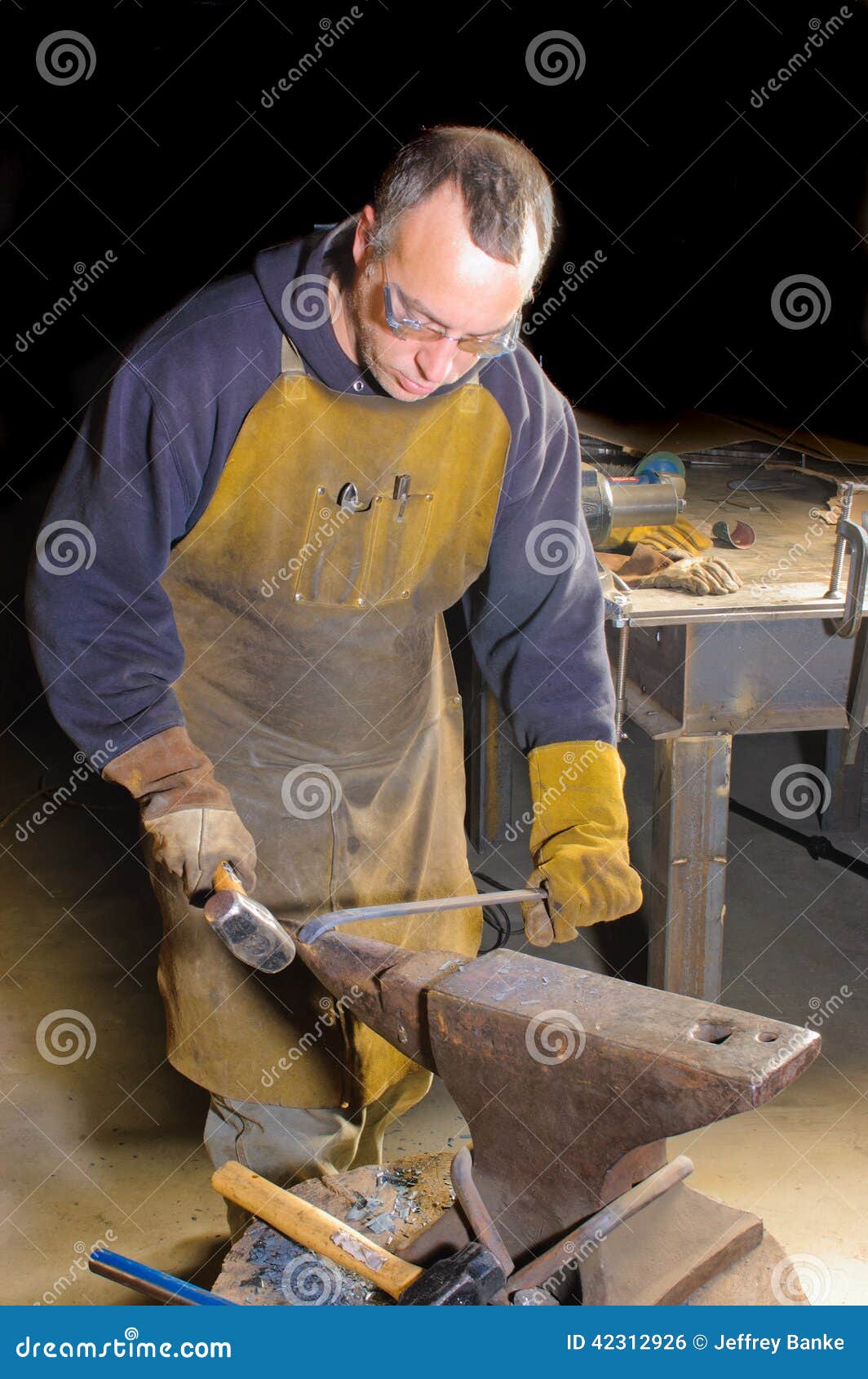 Blacksmith at work stock photo. Image of tradesman, protection - 42312926