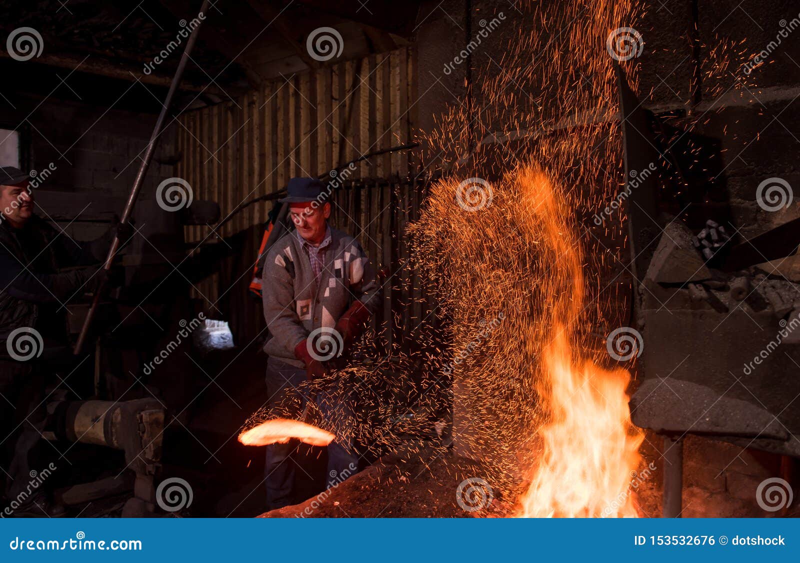 Blacksmith Workers Using Mechanical Hammer at Workshop Stock Photo ...