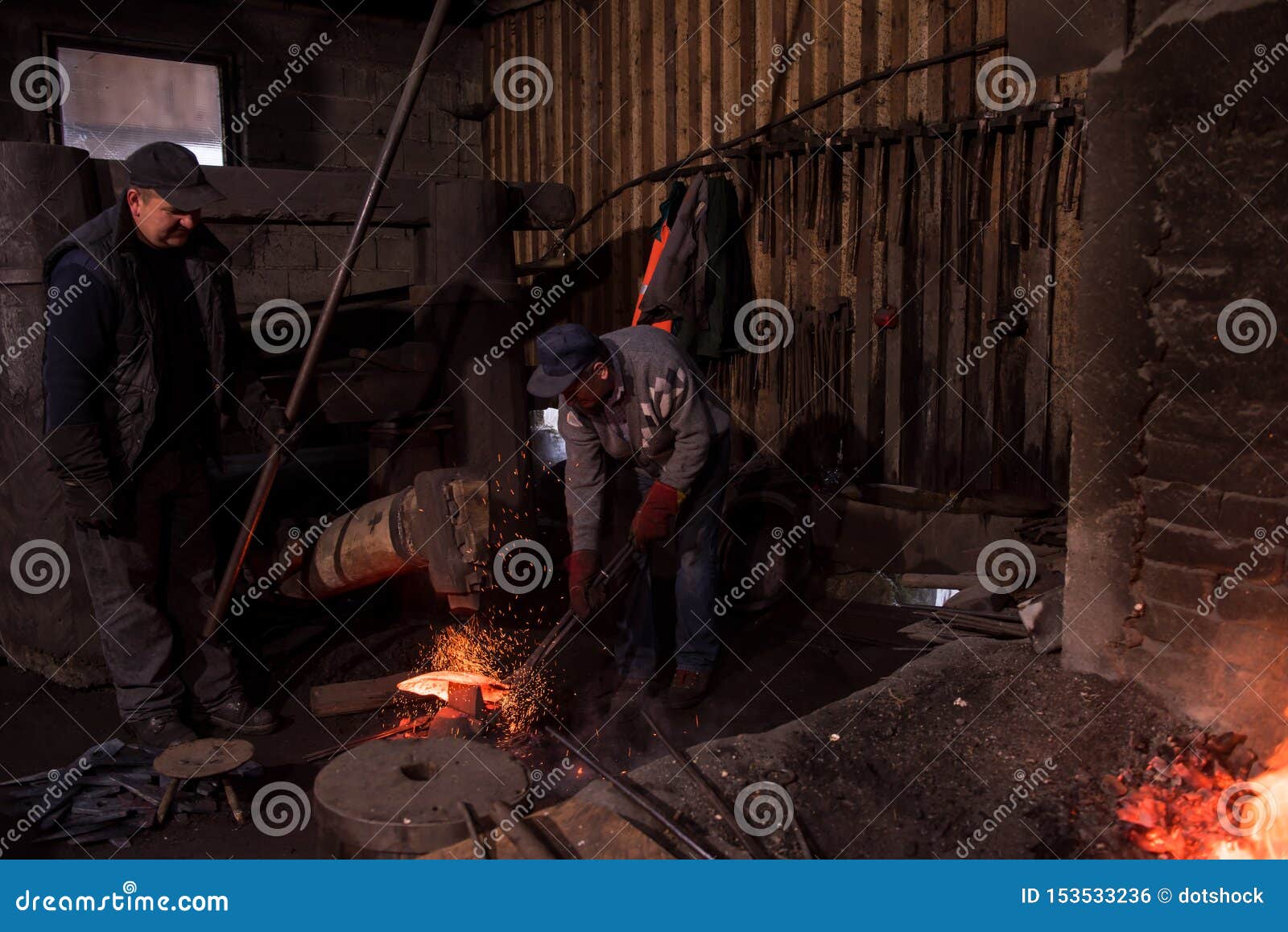 Blacksmith Workers Using Mechanical Hammer at Workshop Stock Photo ...