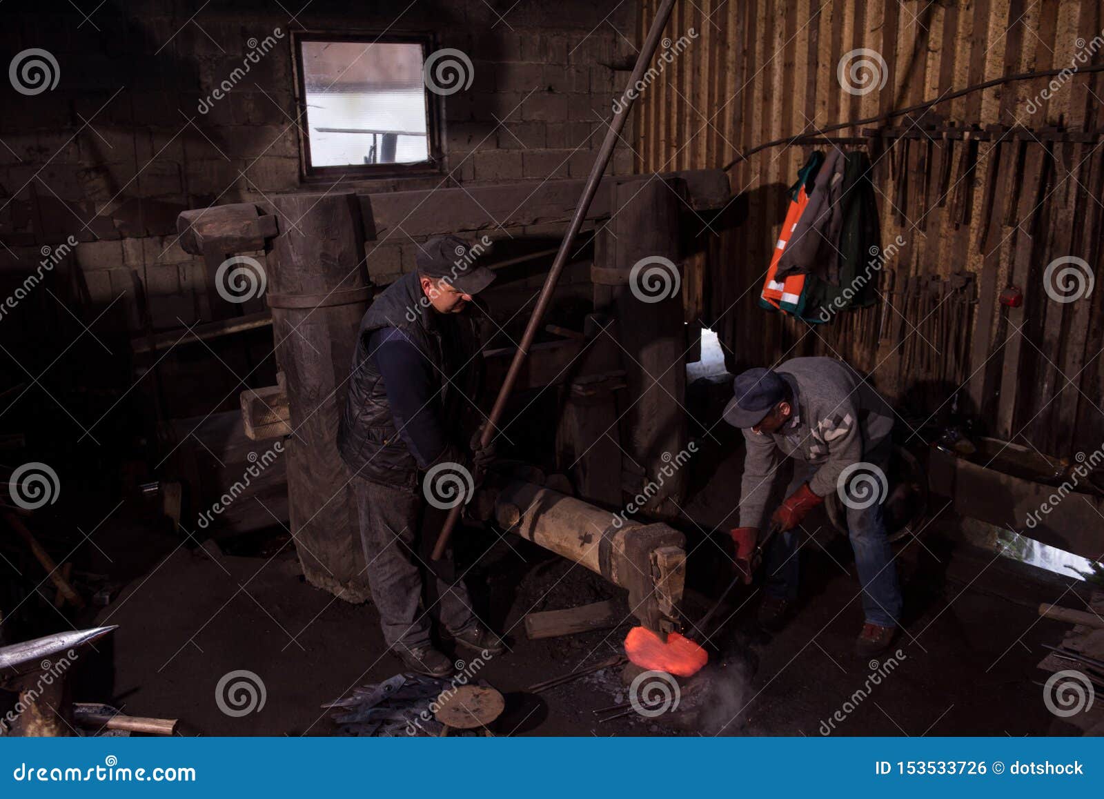 Blacksmith Workers Using Mechanical Hammer at Workshop Stock Photo ...