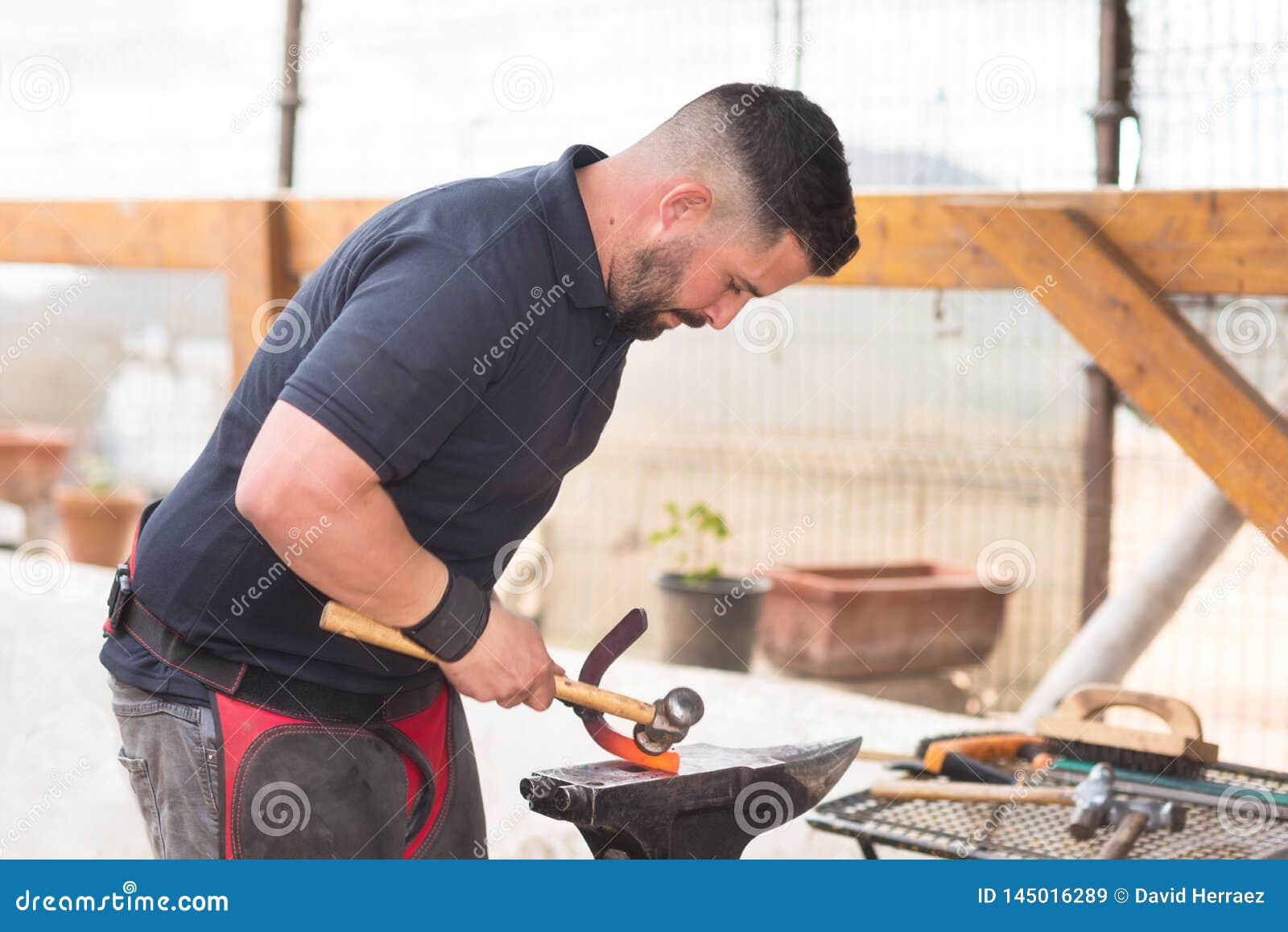 Blacksmith Working on the Anvil, Making a Horseshoe. Stock Image ...