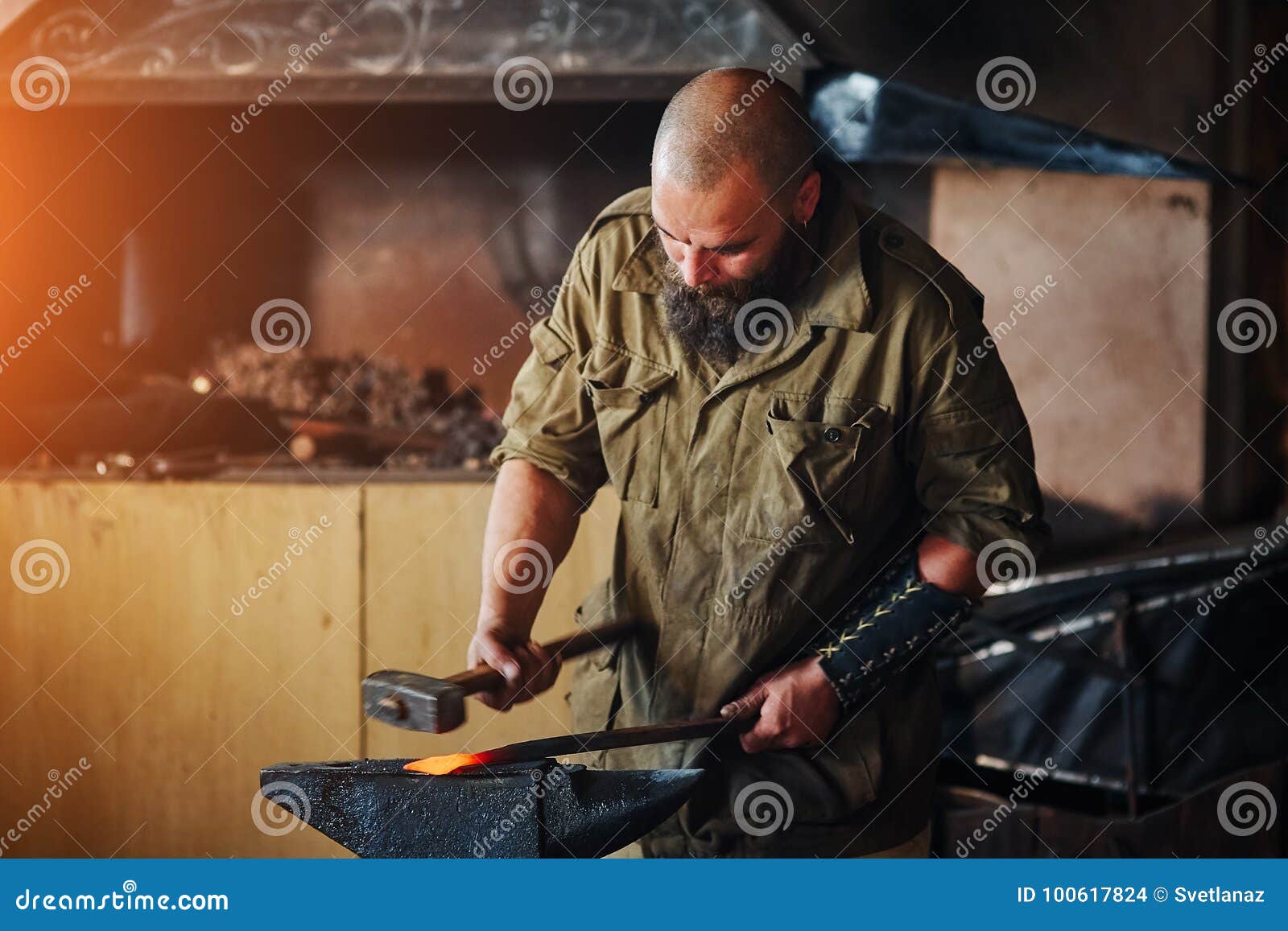 Blacksmith Working in the Forge. Manufacture of Parts and Weapons from ...