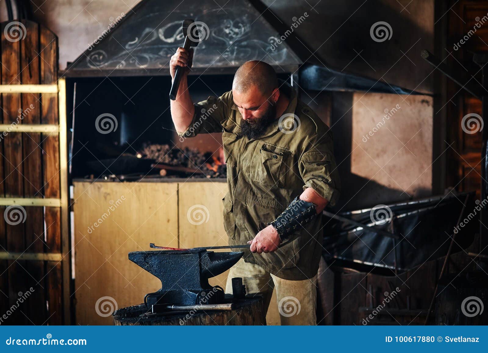 Blacksmith Working in the Forge. Manufacture of Parts and Weapons from ...
