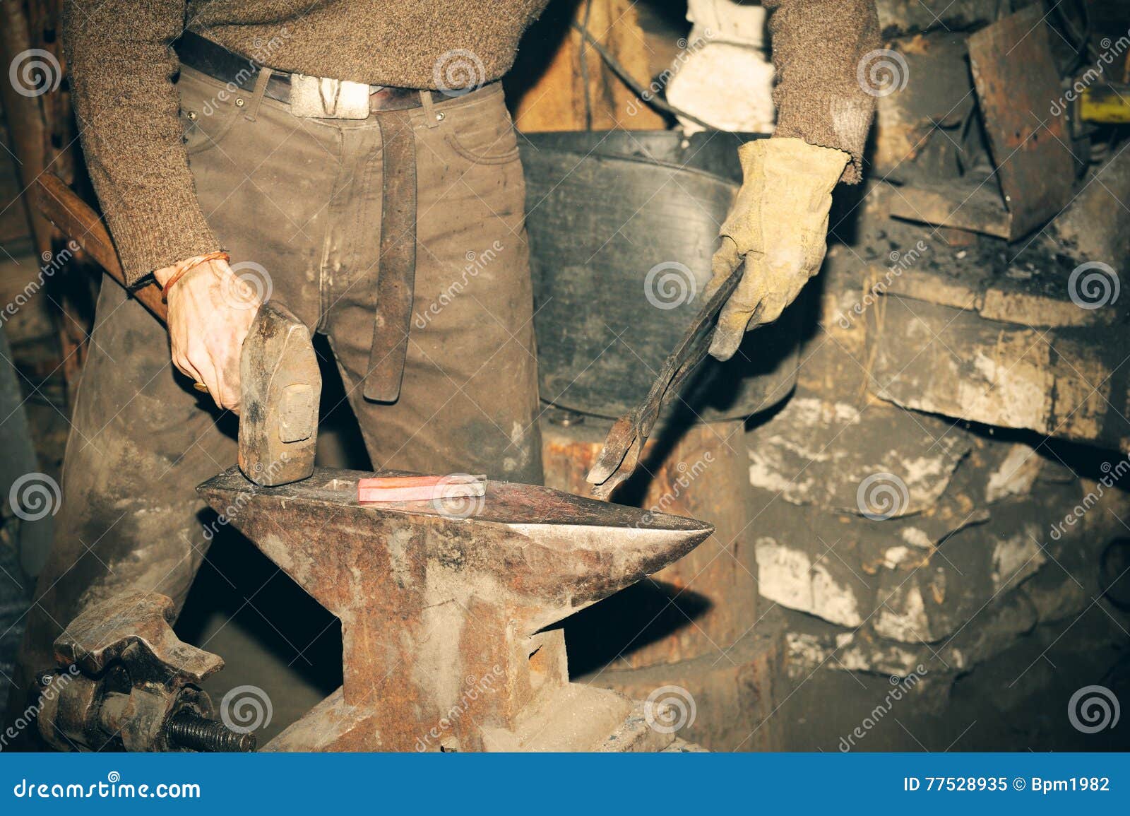 Blacksmith Working in the Forge Processes the Metal . Stock Image ...