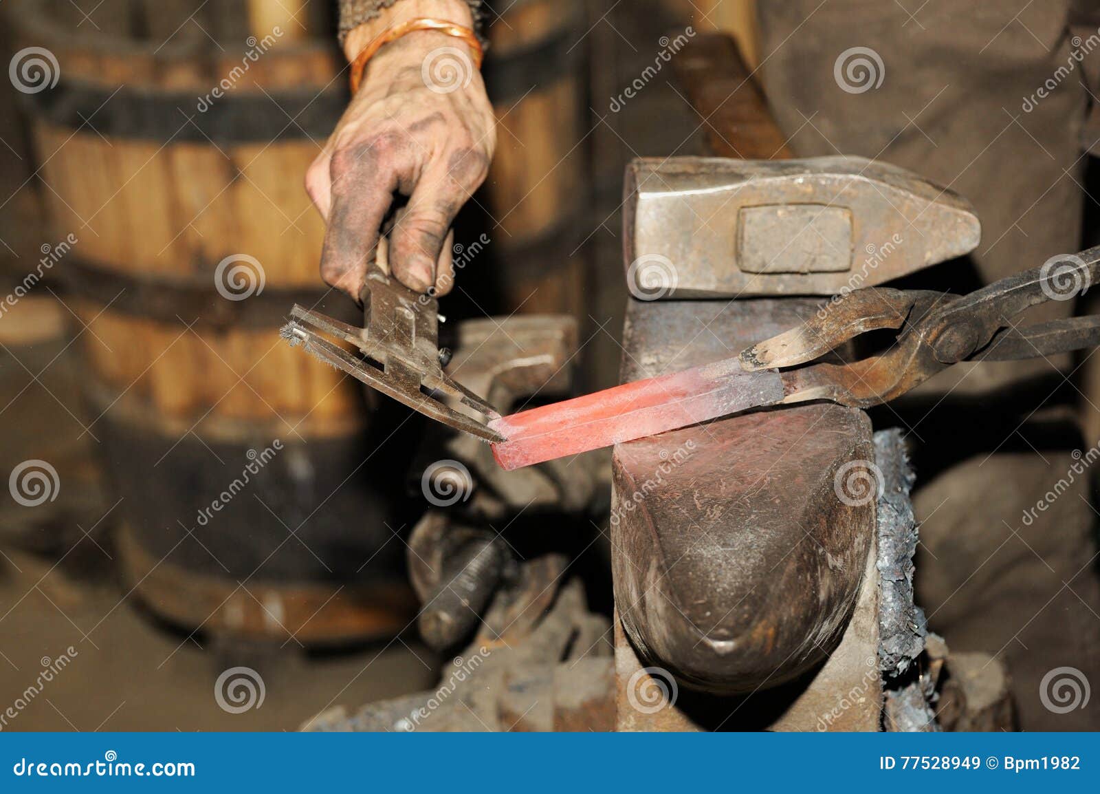 Blacksmith Working in the Forge Processes the Metal . Stock Image ...